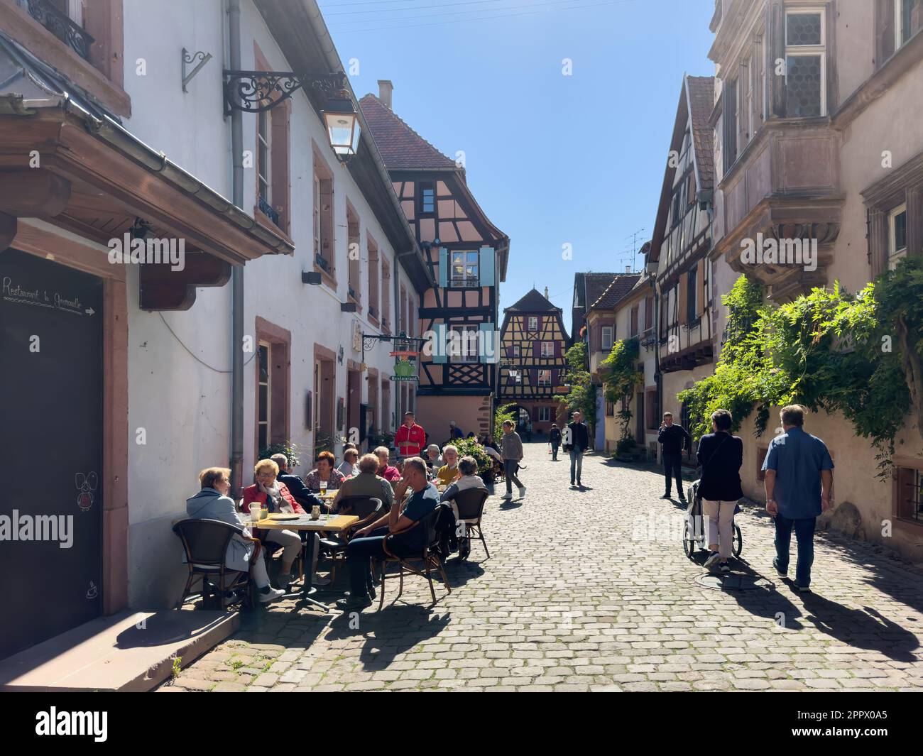 Riquewihr, France - Sep 22, 2022: A group of people enjoy a vintage ...