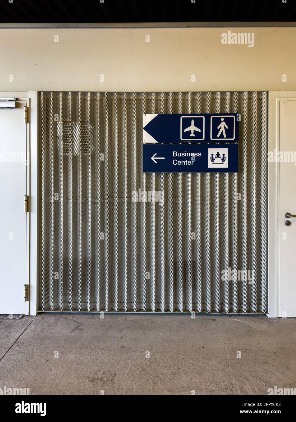 An airport terminal sign guides travelers to their destination, with ...