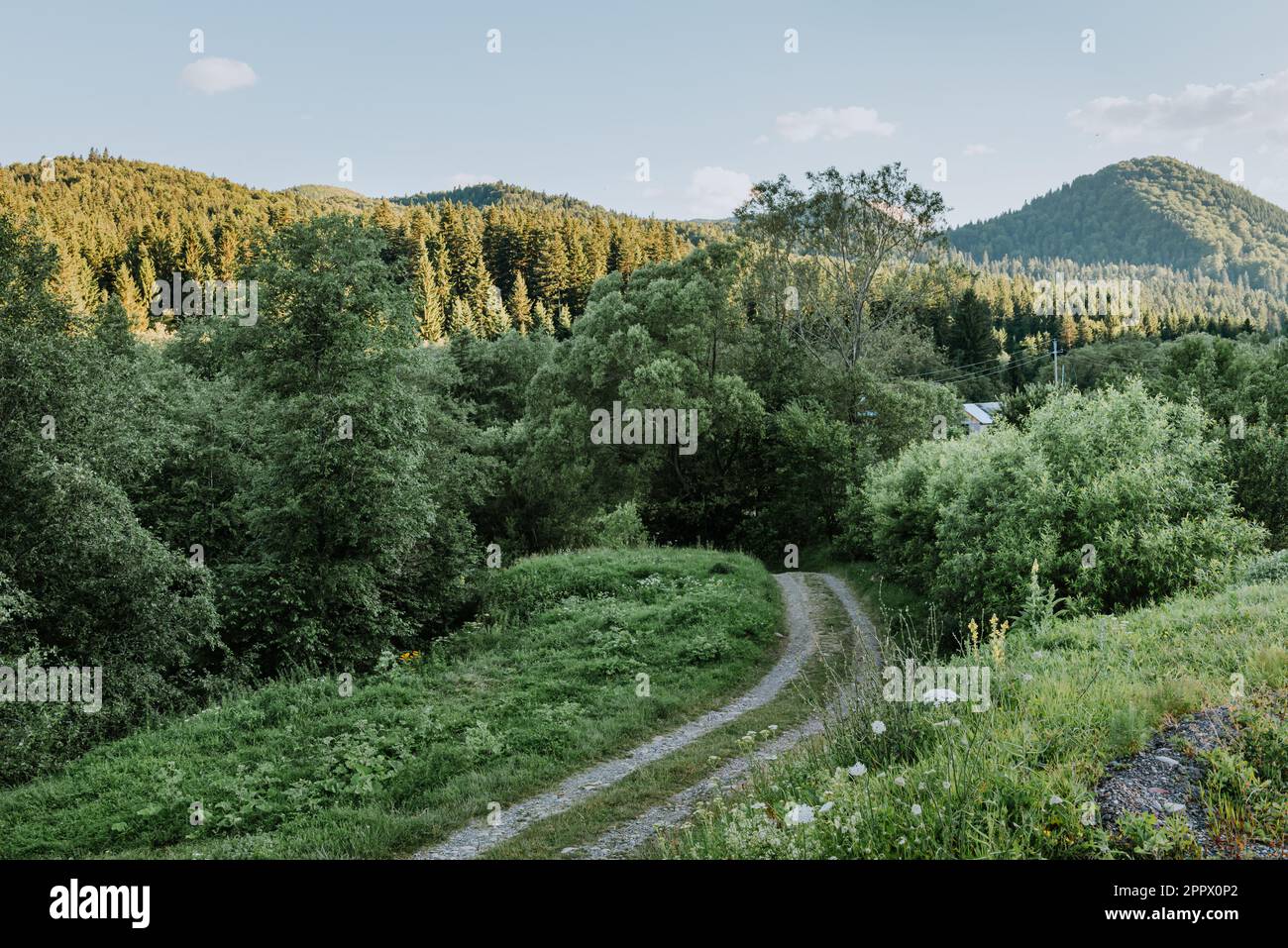 Mountain road. Landscape with rocks, sunny sky with clouds and ...