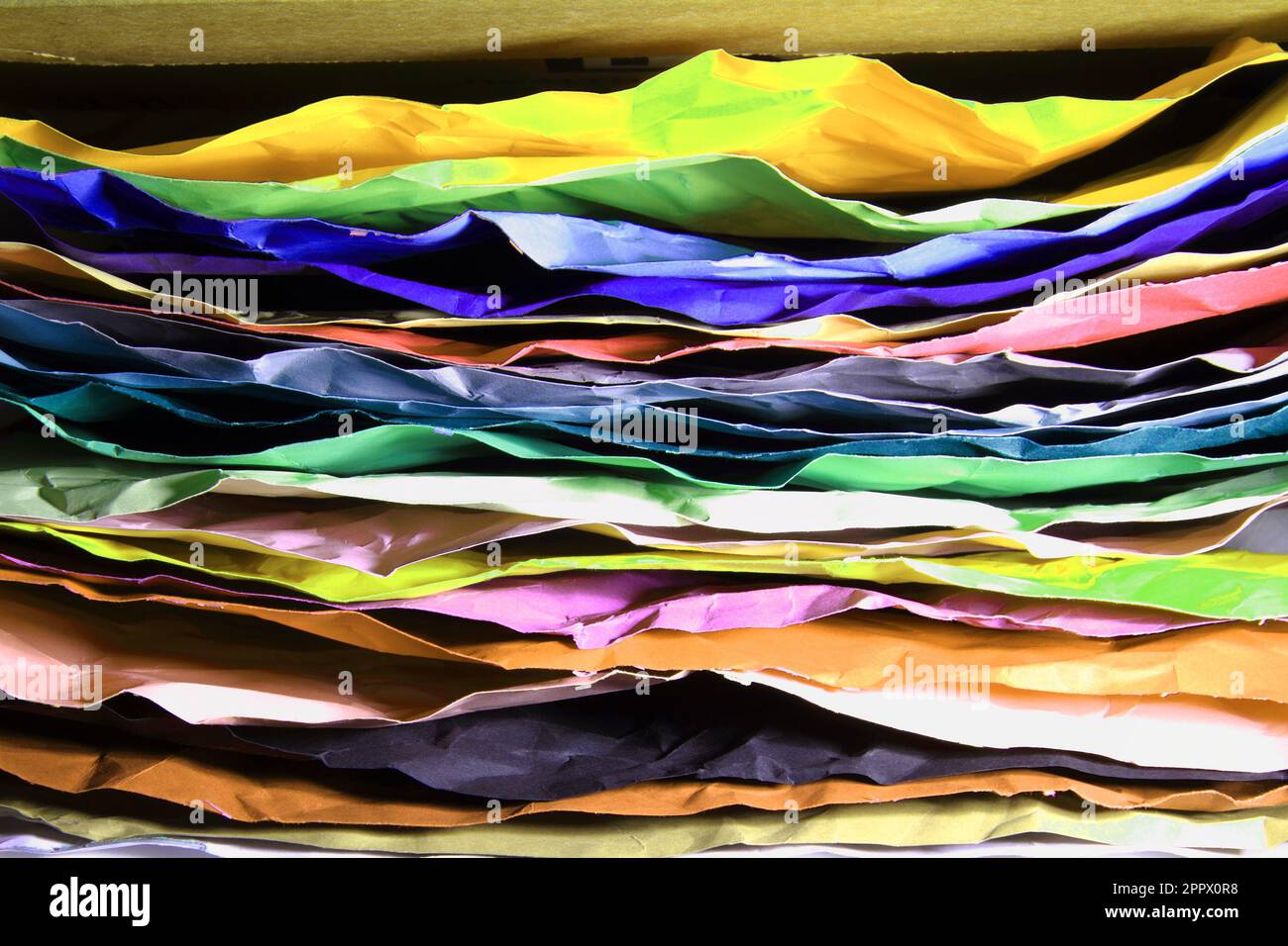 crumpled color papers as very easy background Stock Photo - Alamy