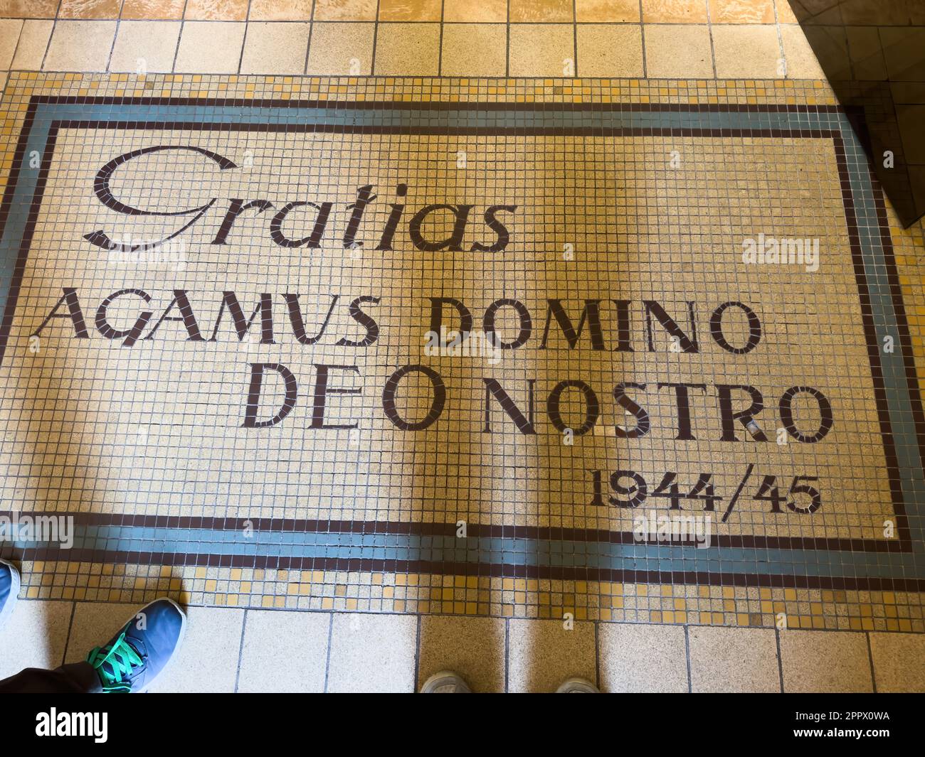 Vintage stone pavement with a beautiful mosaic, bearing the words ...