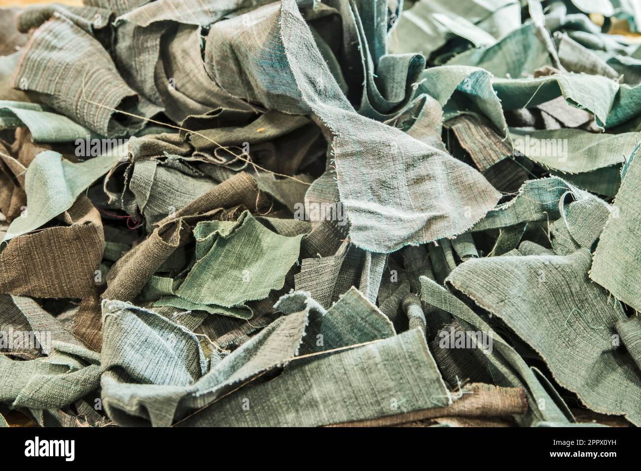Pile of fabric scraps closeup as textile background Stock Photo - Alamy