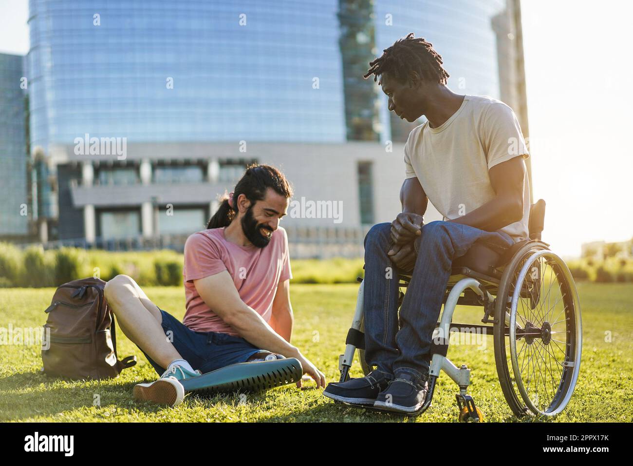 Happy friends with disability having fun at park city - Focus on ...
