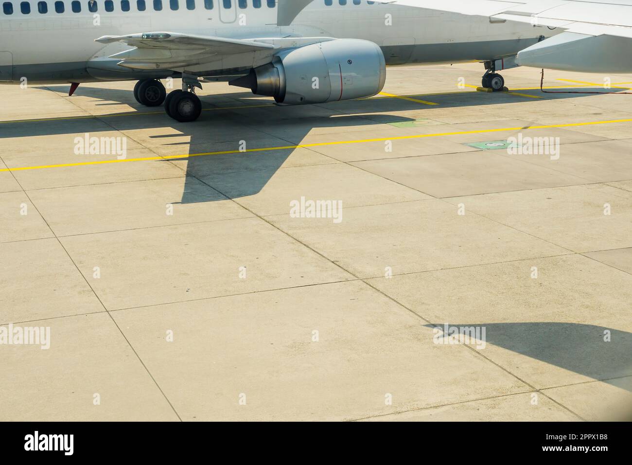 An airplane at an airport runway, ready to transport passengers across ...