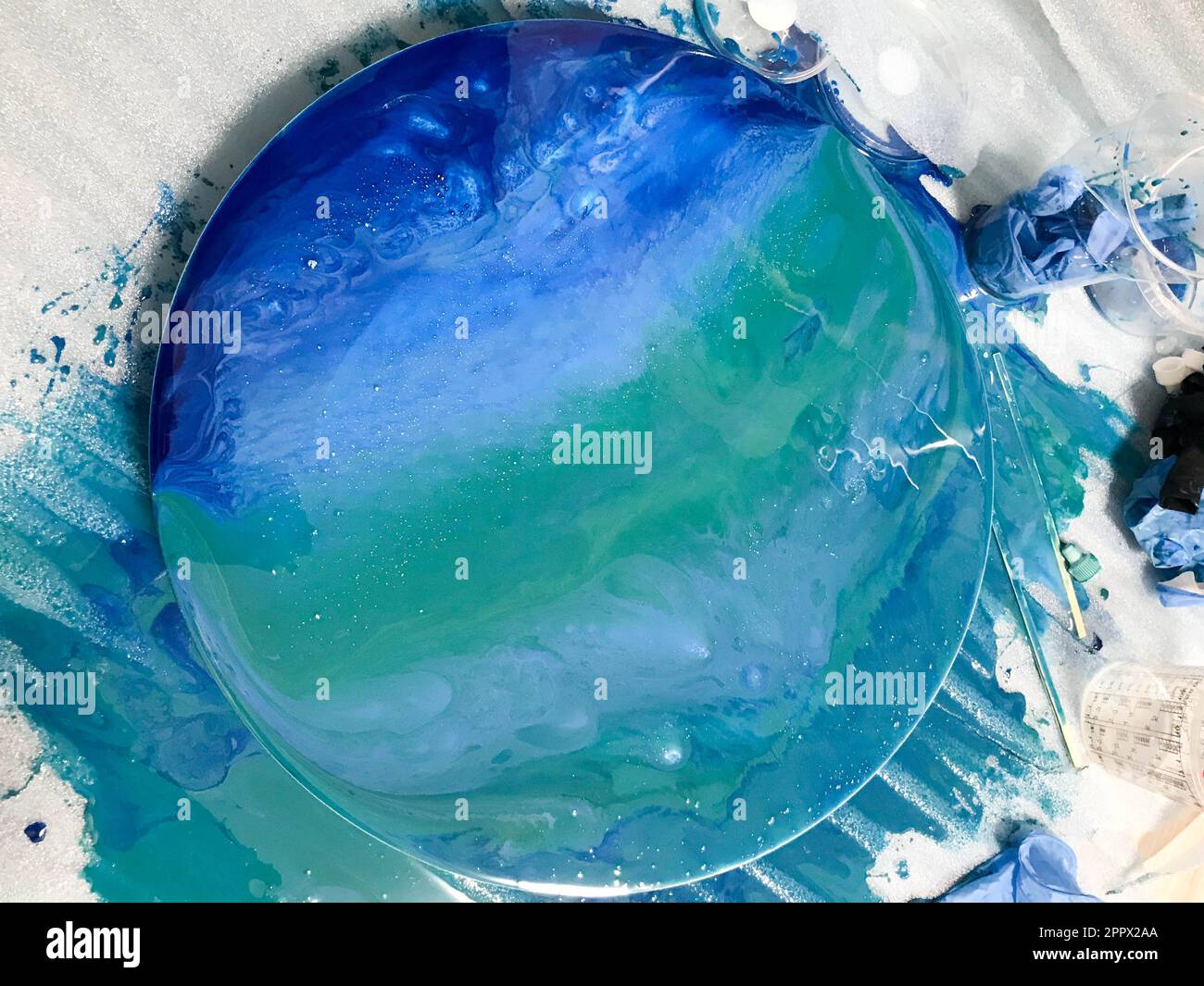 Round interior painting depicting a marine theme. drawing in fluid art technique with epoxy ...