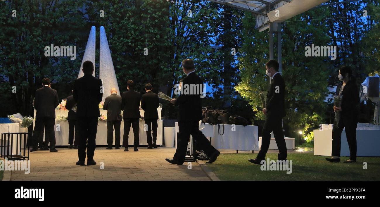 People pray for victims at a memorial facility at the accident site in Amagasaki City, Hyogo ...
