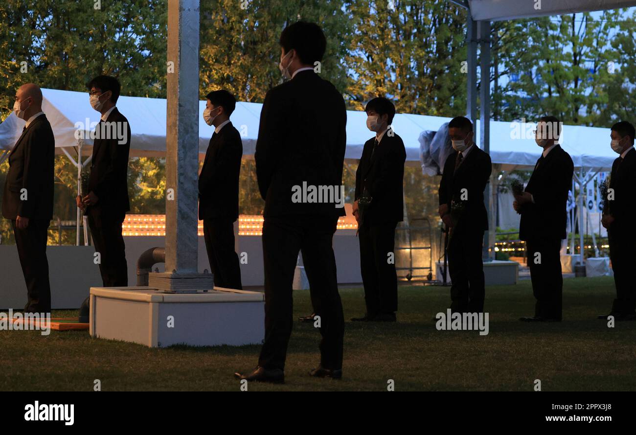 People pray for victims at a memorial facility at the accident site in Amagasaki City, Hyogo ...