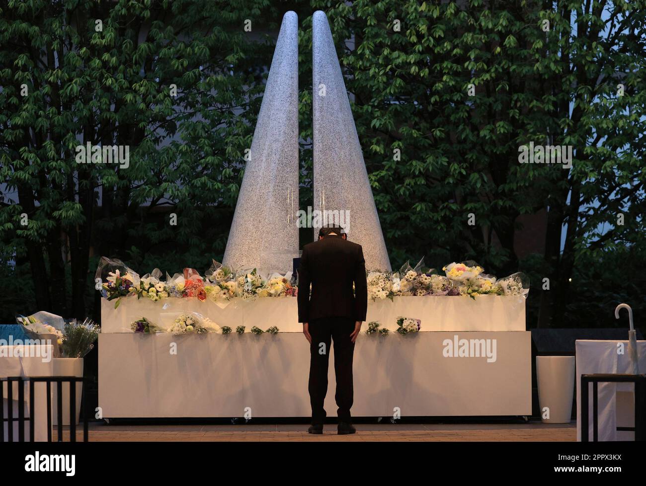 People pray for victims at a memorial facility at the accident site in Amagasaki City, Hyogo ...