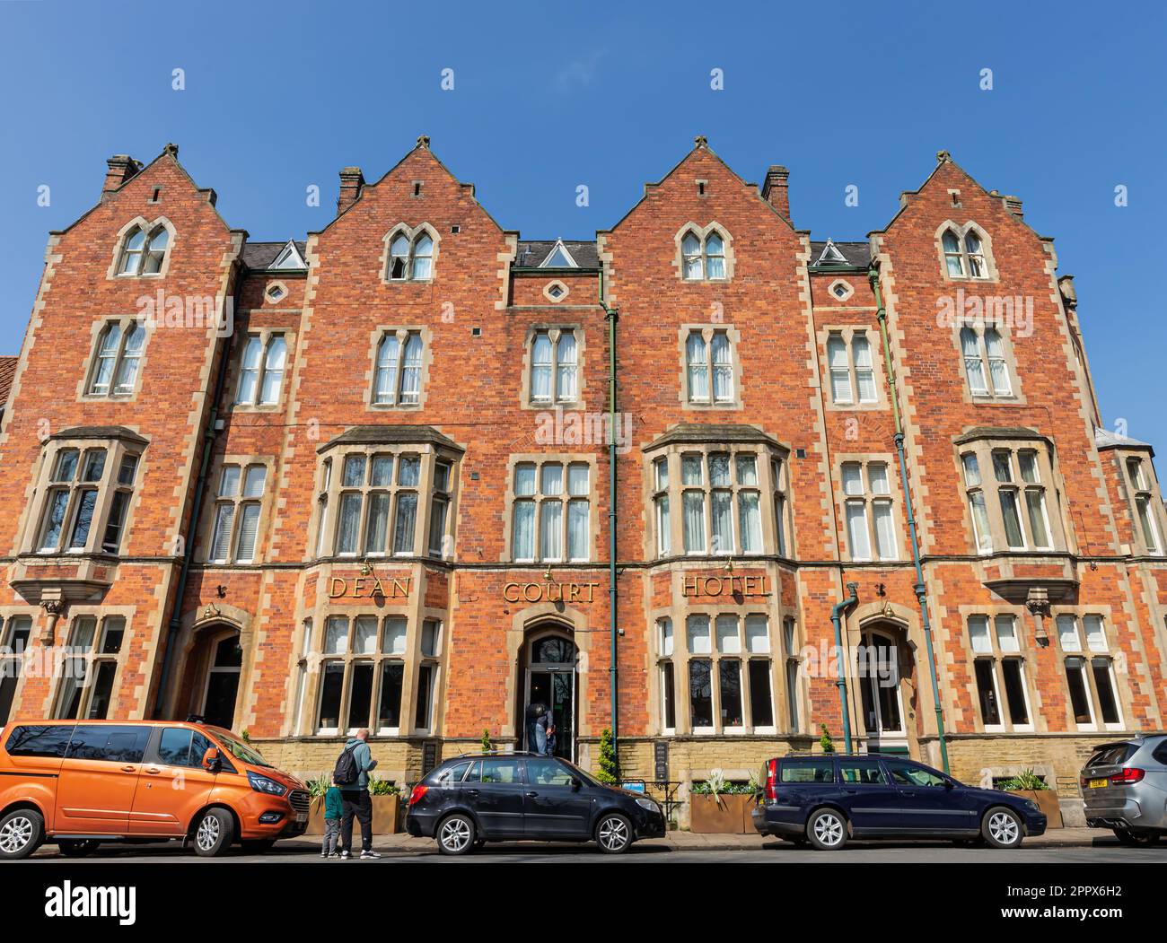 A 19th Century red brick building stretches up to a clear sky. Now a ...