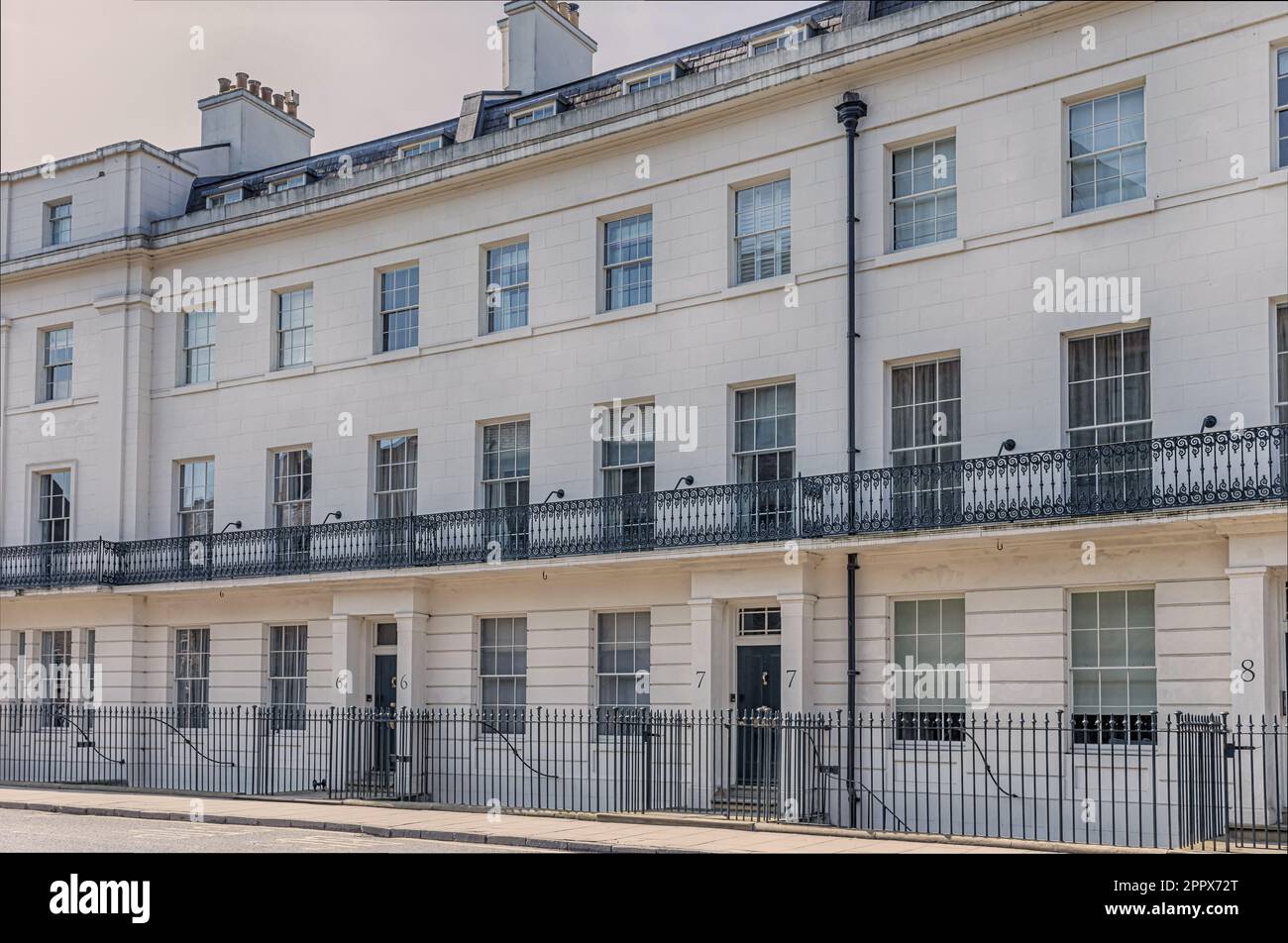 The 19th Century curved Georgian styled building. Black wrought iron ...