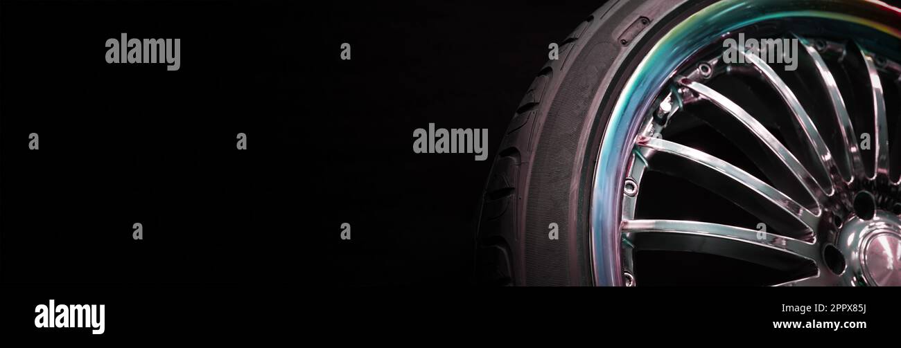 Tires and wheels of the copy space market with a black background ...