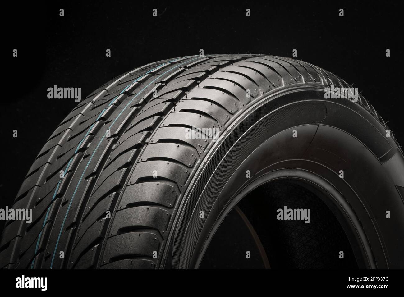 Tire close-up on a black background, side view Stock Photo - Alamy