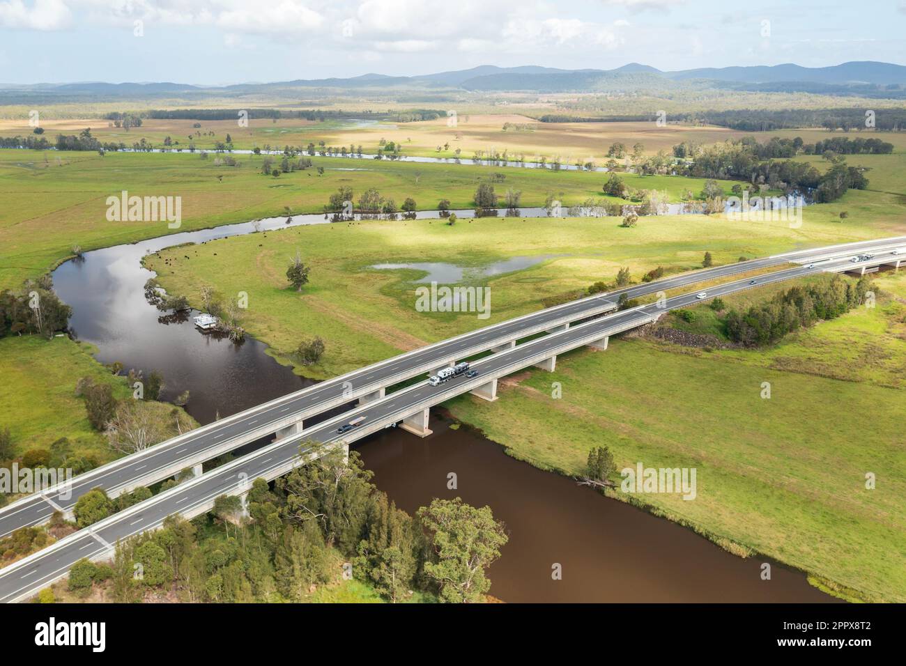 Aerial view of the Pacific Highway crossing a meandering Myall River at ...