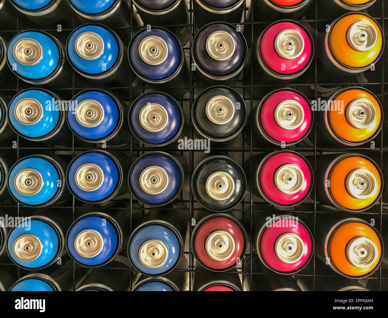 Colorful and textured background of a wall full of multicolored spray ...