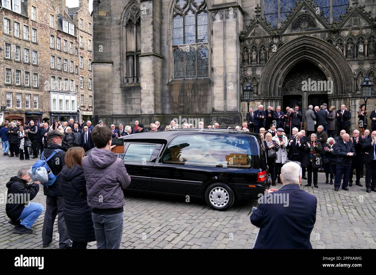 A pair of white boxing gloves rest on the coffin of former boxer Ken ...