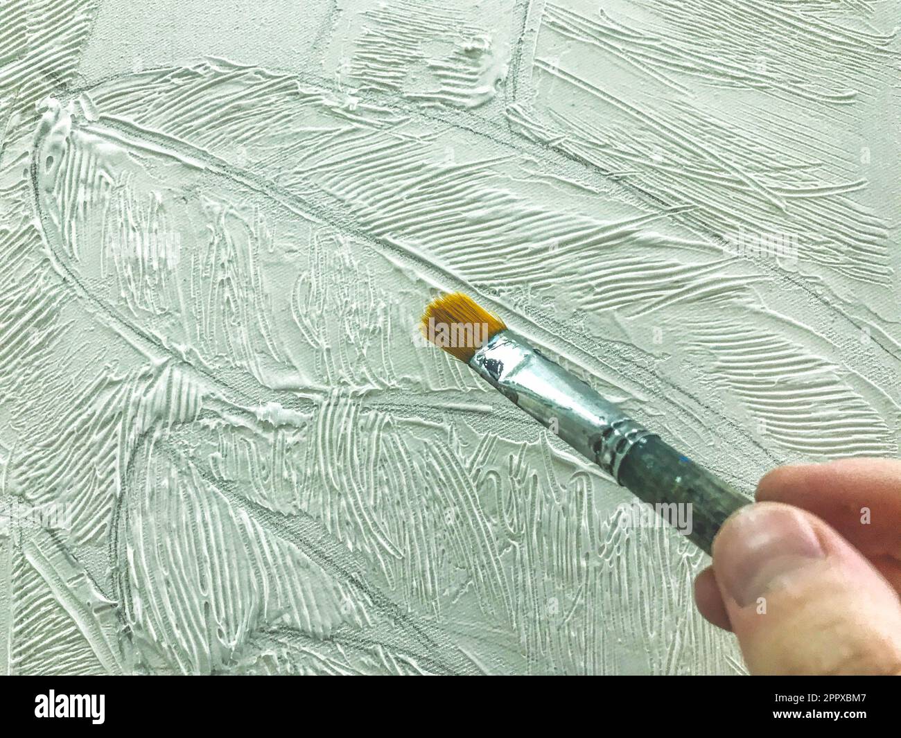 the canvas is painted with white paint. brush strokes on canvas. white ...