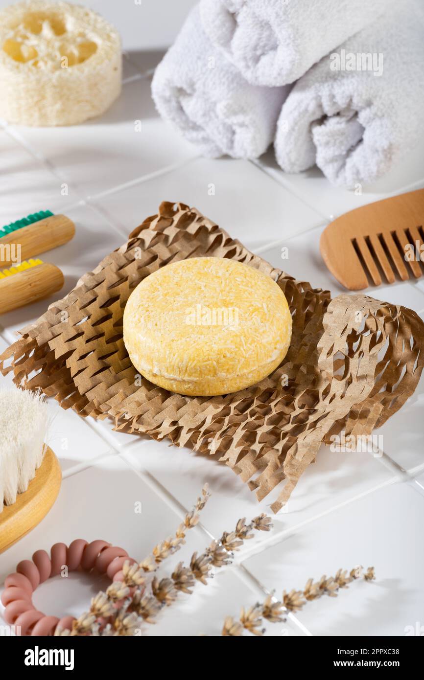 Eco friendly solid shampoo bar and natural bathroom accessories lying ...