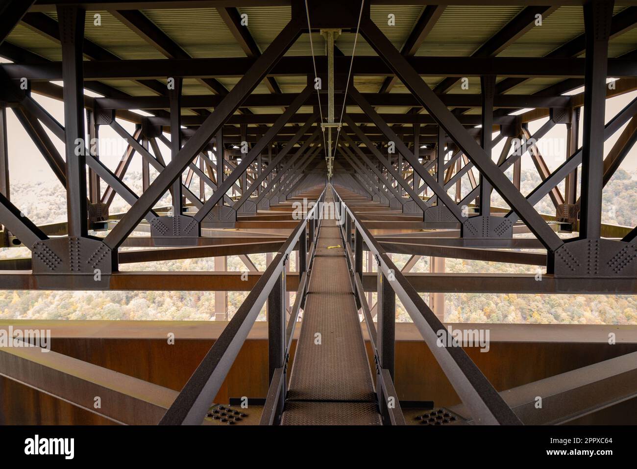 A metallic bridge with a steel frame structure and beams spanning ...
