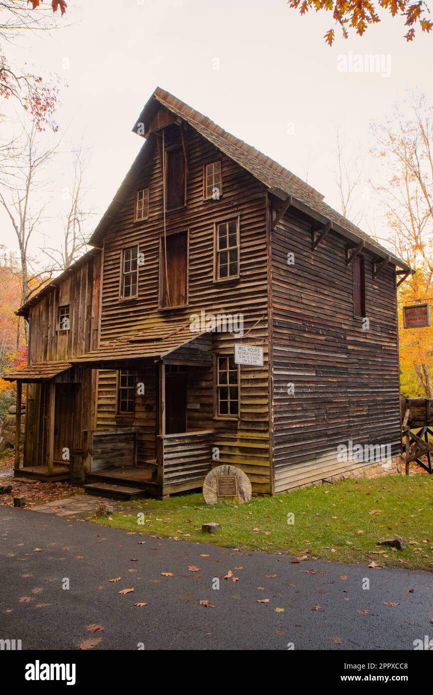 A charming wooden building situated on a corner of a road in a ...