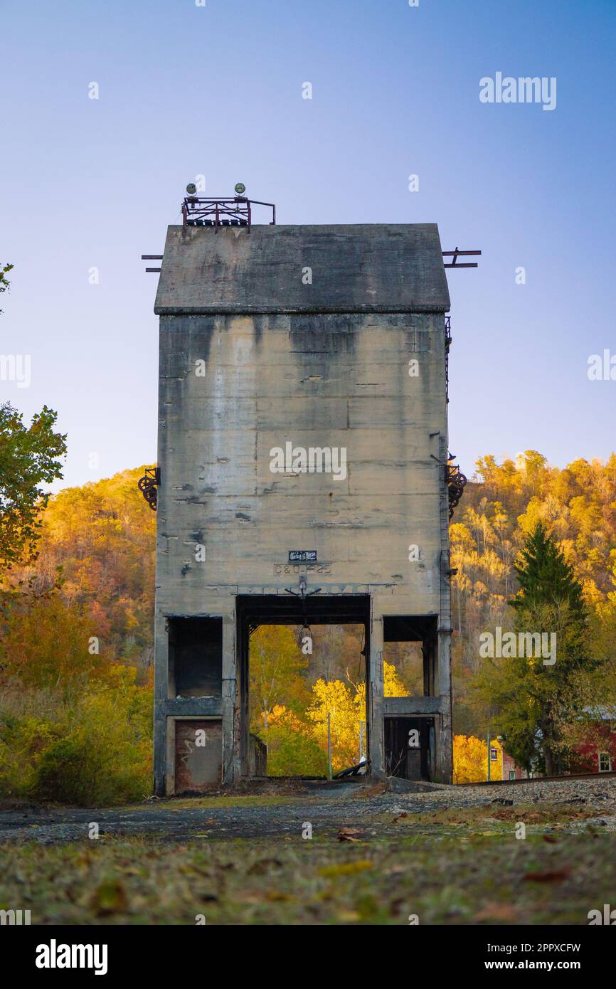 A vintage grain silo stands alone in the rural countryside, surrounded ...