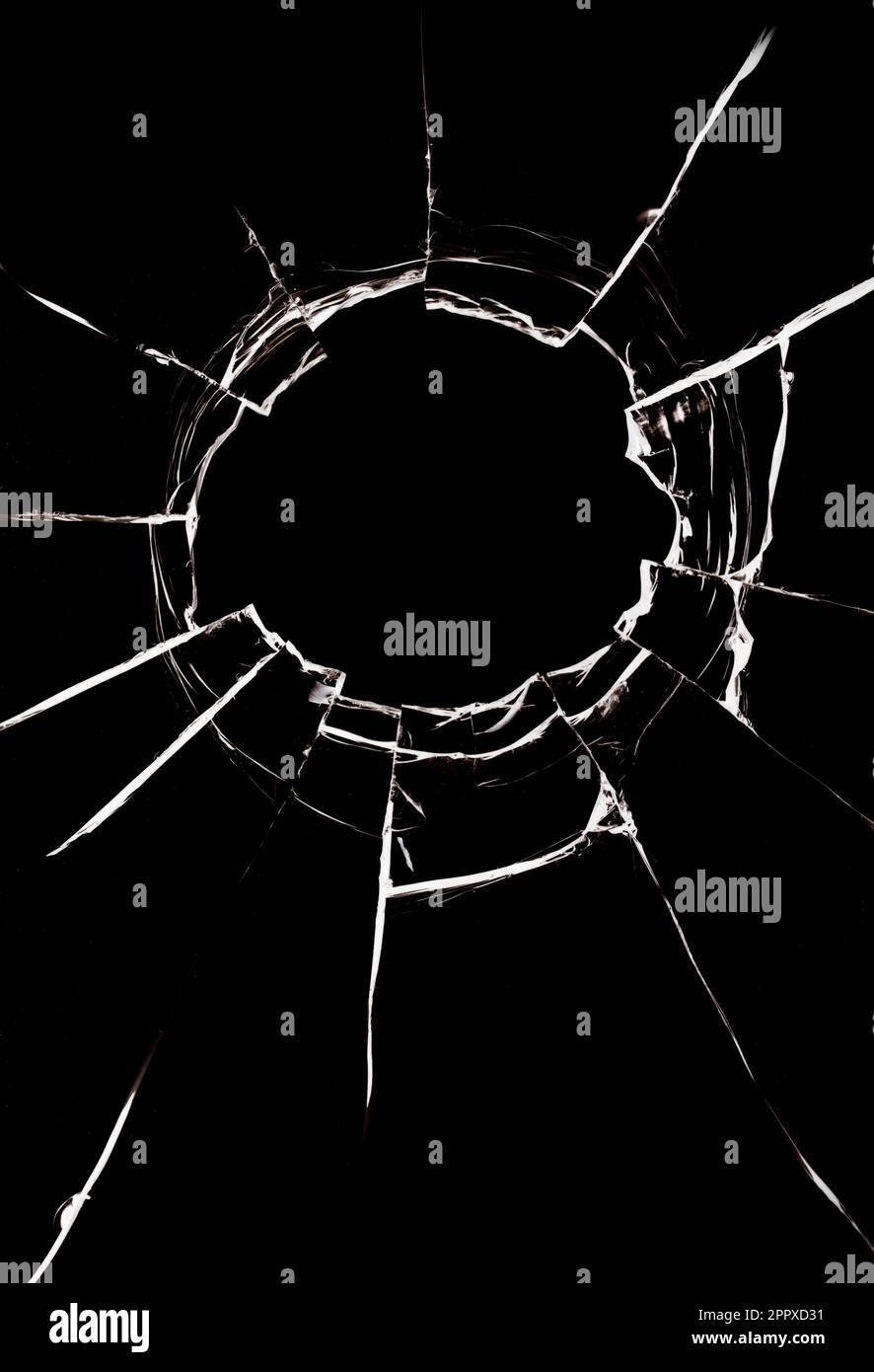 Broken window, background of cracked glass with a hole from a shot or ...