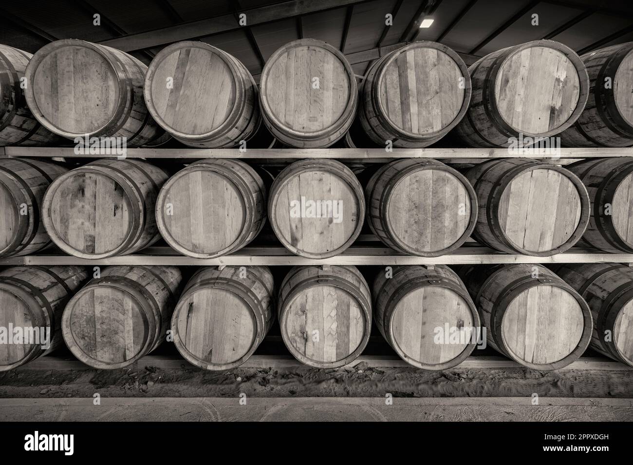A black and white image of a front on view of a row of stacks of ...