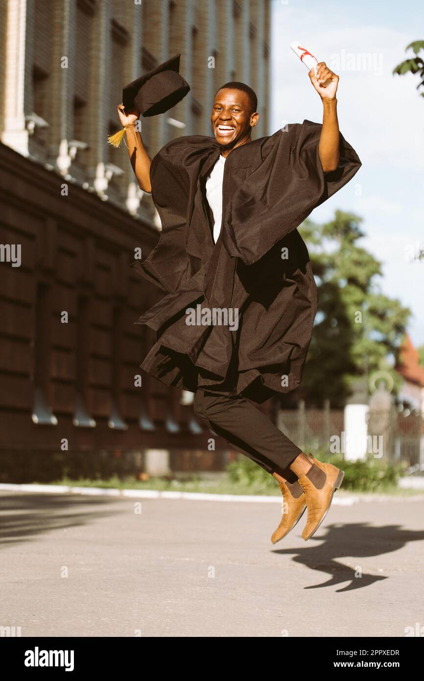 Young man in graduation robe hi-res stock photography and images - Alamy