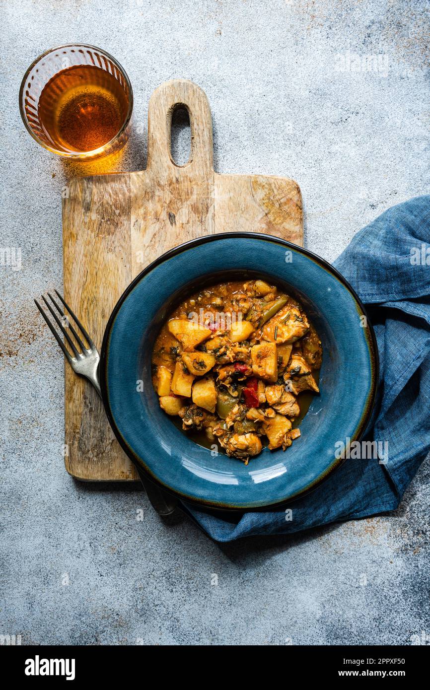 Top view of a chicken meat stew with vegetables served in the ceramic ...
