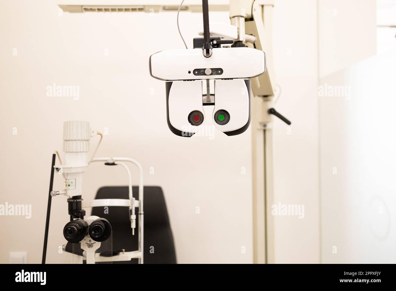 Modern professional ophthalmic equipment placed in light contemporary ...