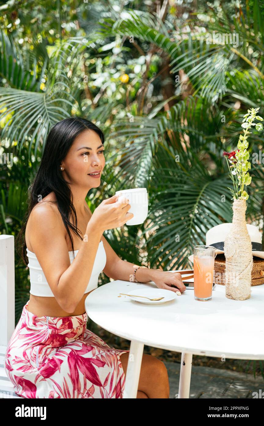 Full body of positive young mixed race female in summer outfit smiling ...