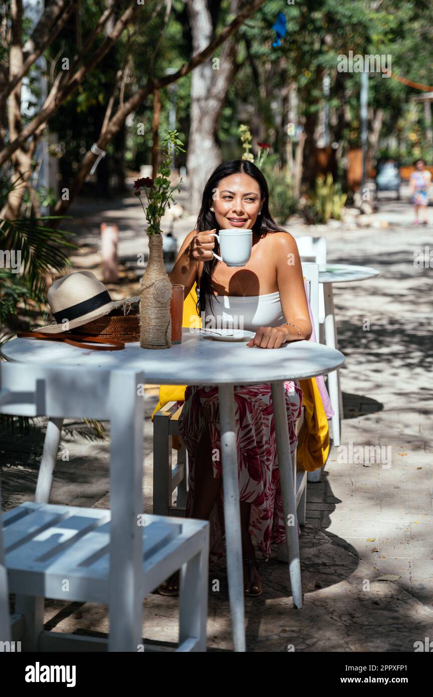 Full body of positive young mixed race female in summer outfit smiling ...