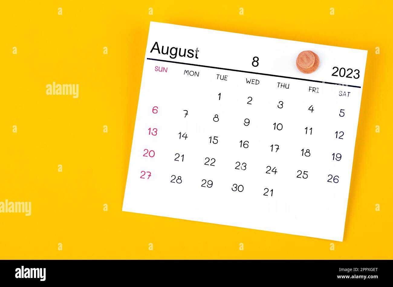 August 2023 and wooden push pin on yellow background Stock Photo - Alamy