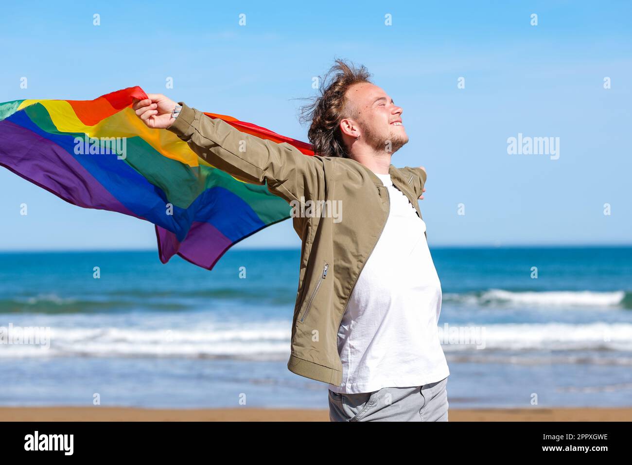 Side view of delighted transgender man after transitioning celebrating ...