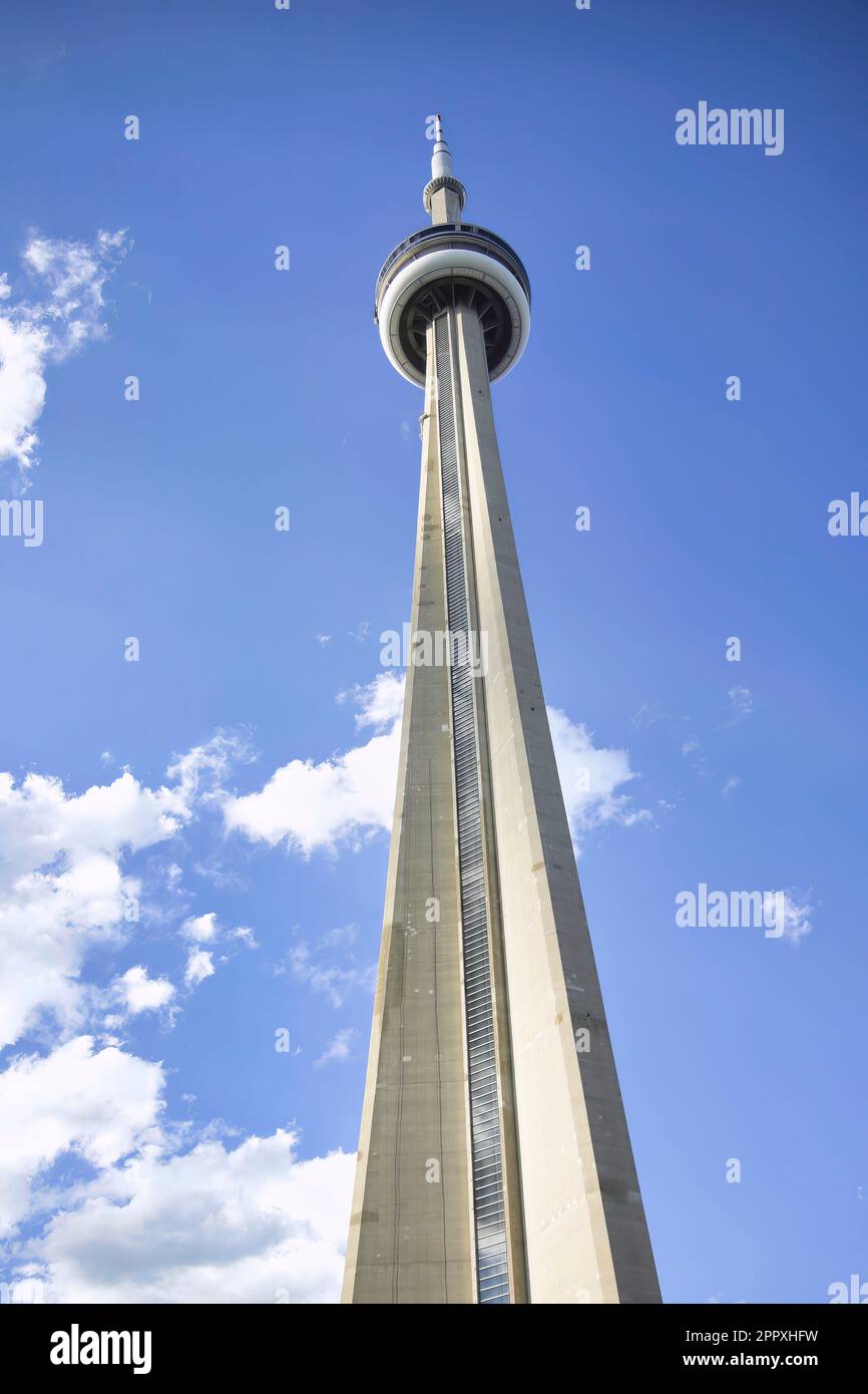A vertical low angle shot of a tall and majestic skyscraper in the city ...