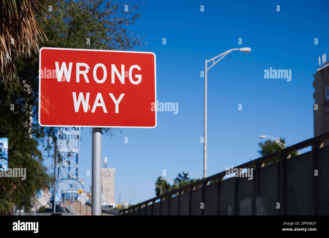 Red and White Wrong Way Road Sign Post Stock Photo - Alamy