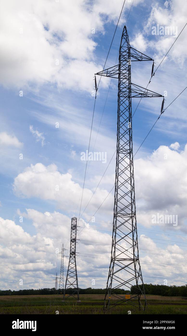 Electricity Pylon power line transmission tower at sunset. High voltage ...