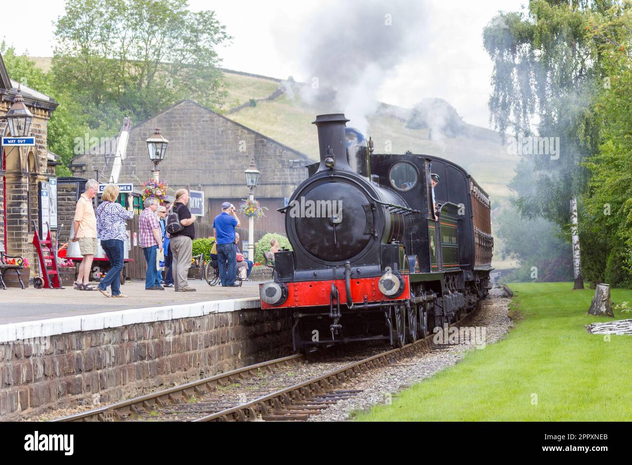 A Steam passenger train arriving at Oakworth on the Keighley & Worth ...