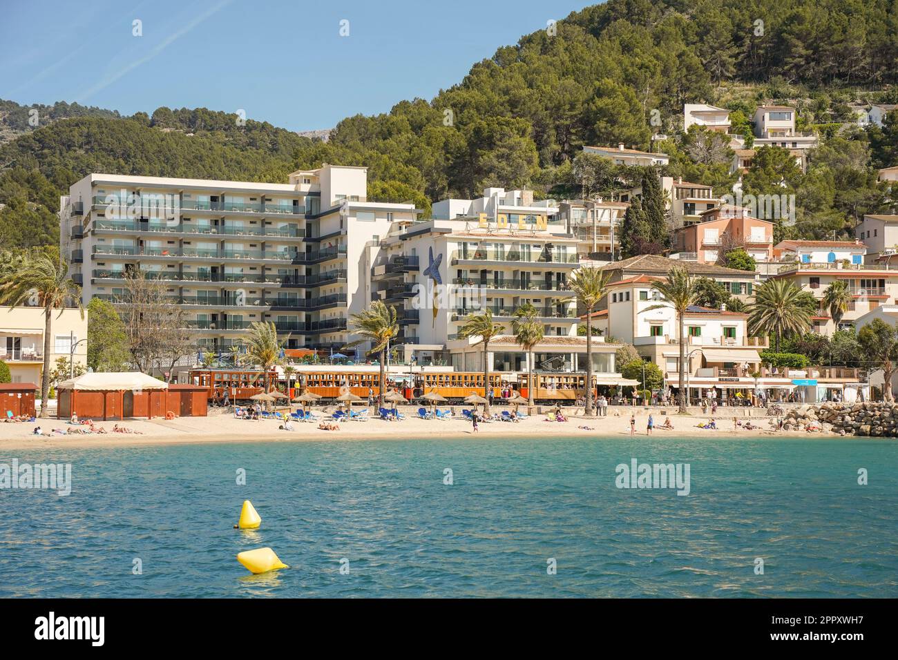 Historic train passing along the beach of Puerto Soller, Soller ...