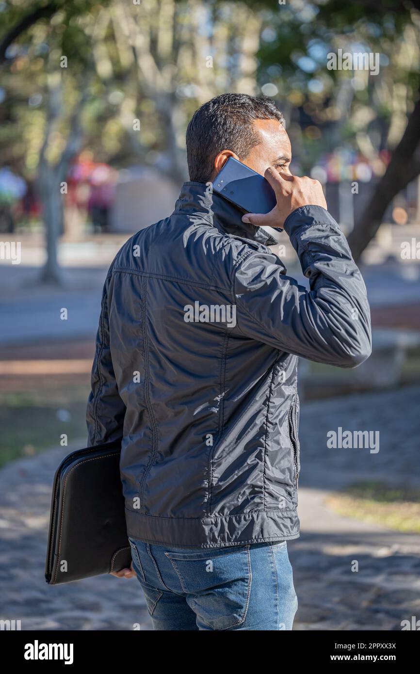 Man from behind walking hi-res stock photography and images - Alamy