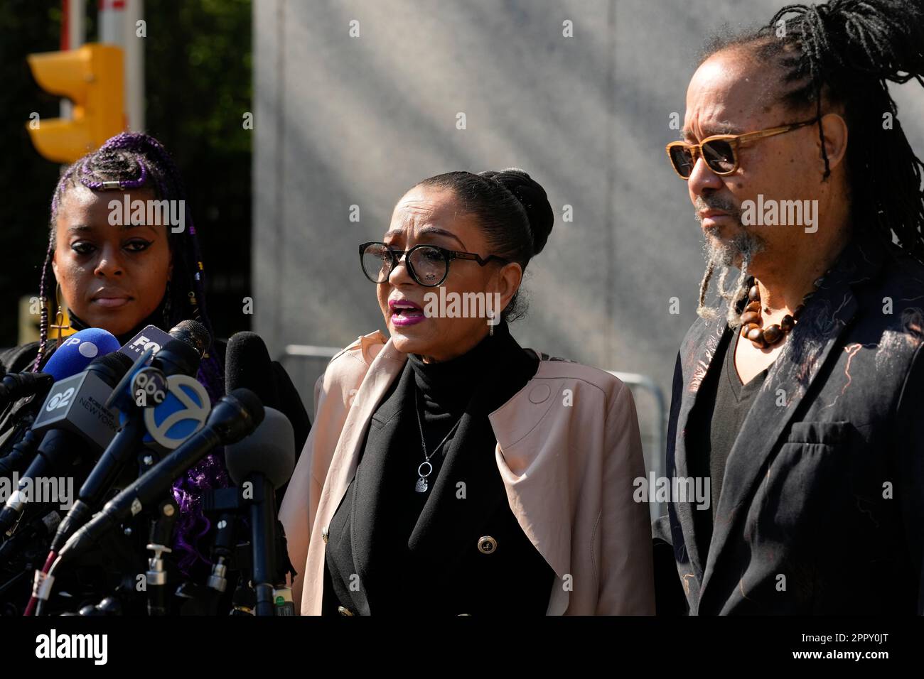 Kathryn Townsend Griffin, center, daughter of singer and songwriter Ed Townsend, speaks outside ...