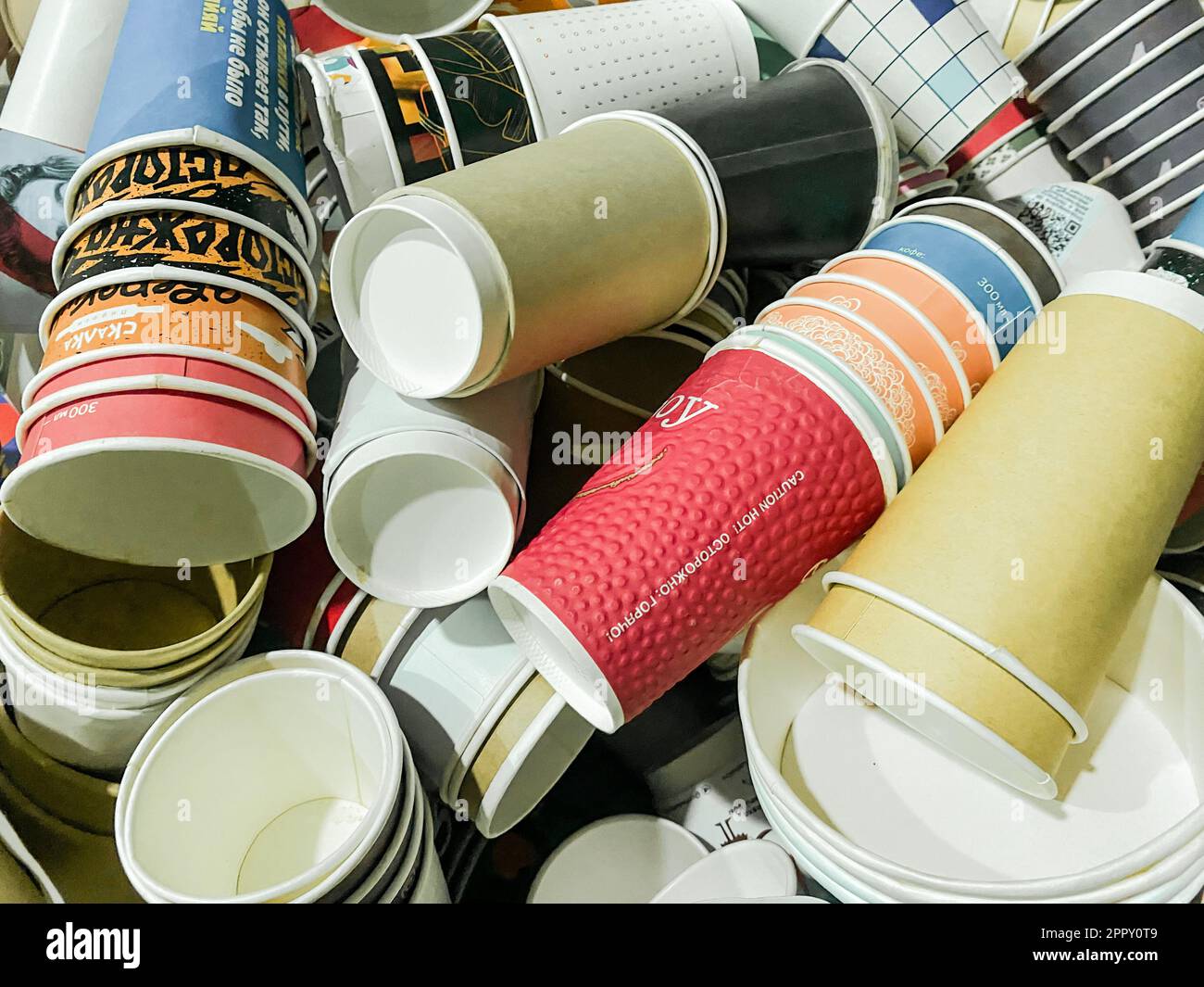 Moscow, Russia, November 2022: A bunch of colorful used coffee cups ...