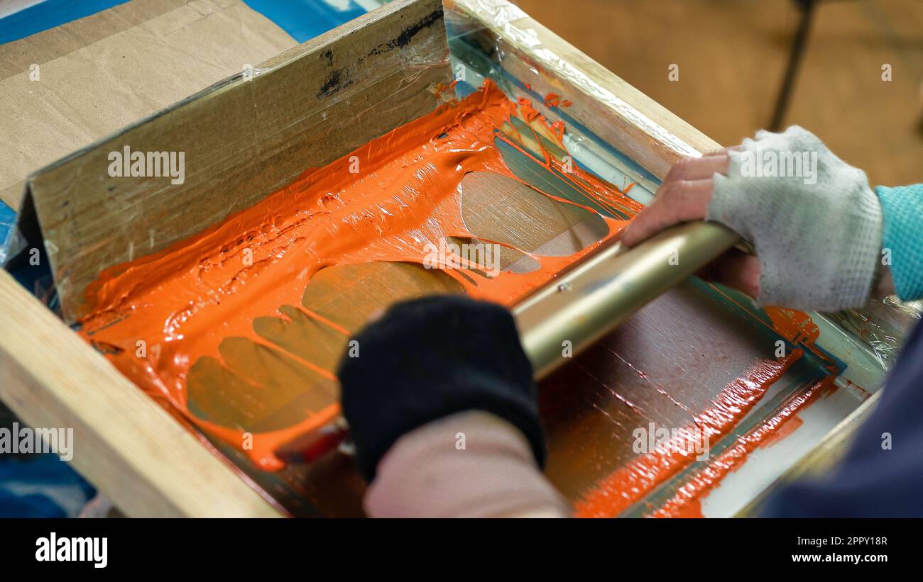 Hand pressing silk screen hi-res stock photography and images - Alamy