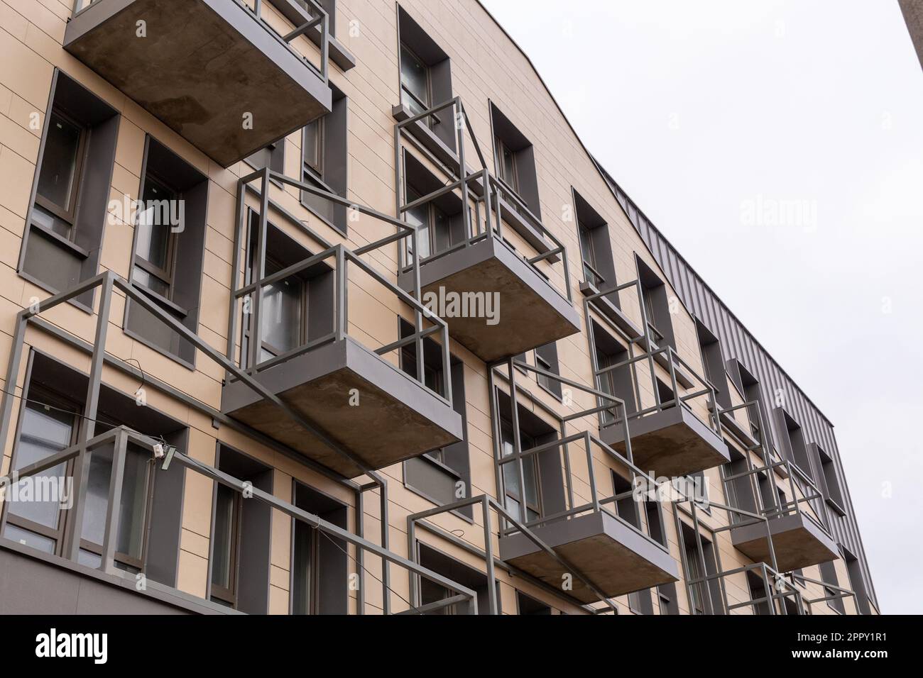 Modern building fasade or exterior. Details of new constructed multi ...