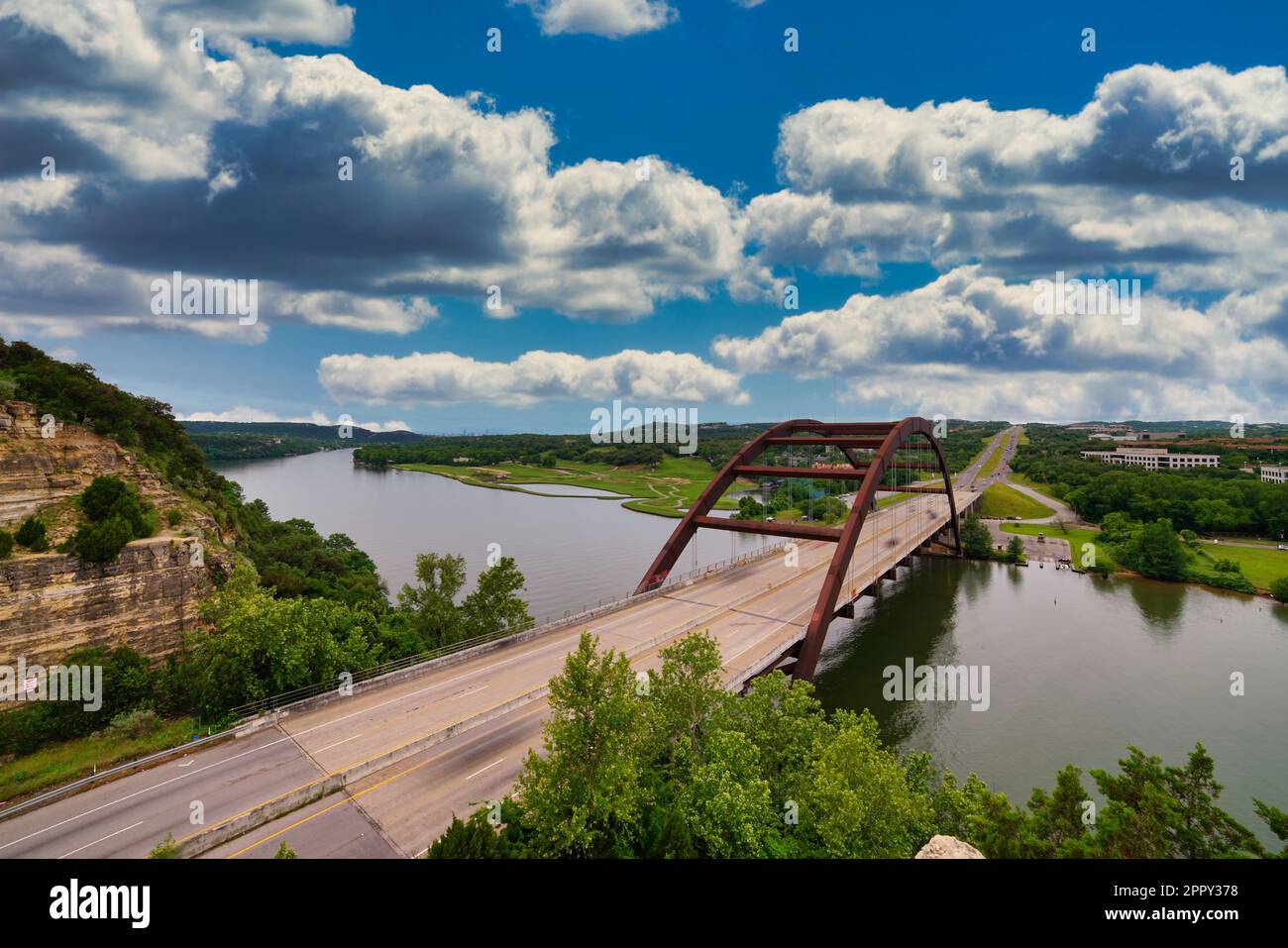 A magnificent bridge spanning a mighty river, connecting two parts of ...