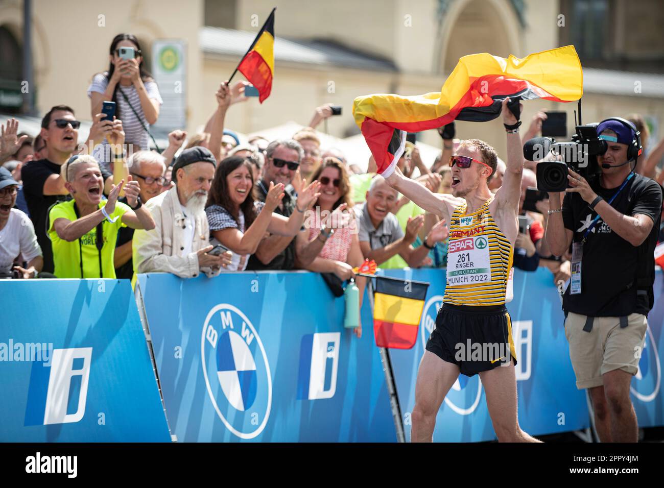 Richard Ringer with his country's flag celebrating his victory in the ...