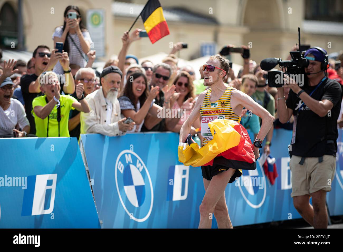 Richard Ringer with his country's flag celebrating his victory in the ...