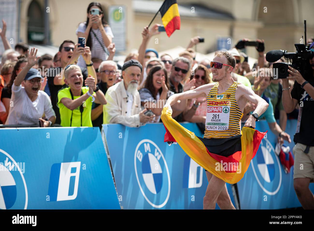 Richard Ringer with his country's flag celebrating his victory in the ...