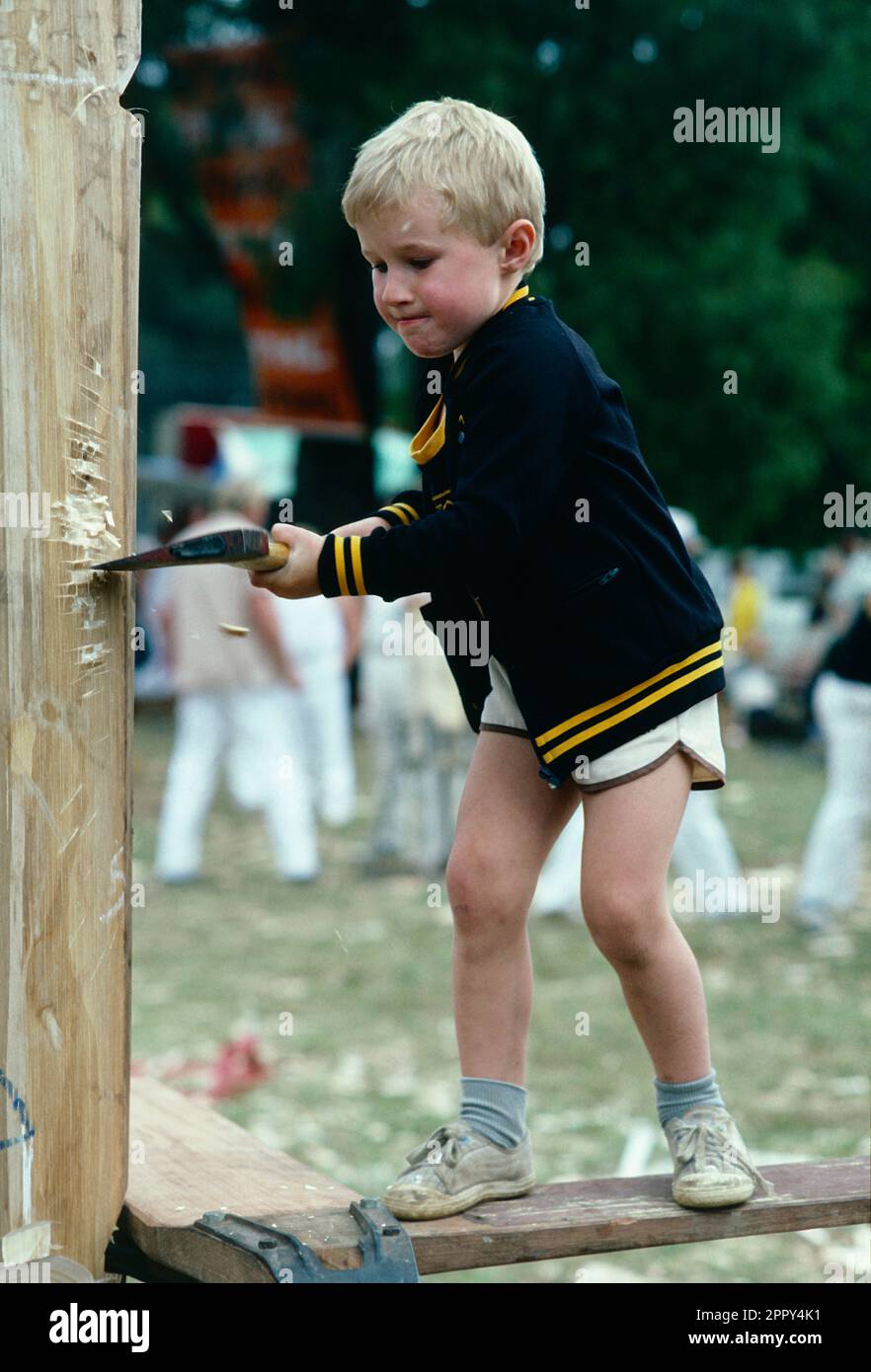 Australia. Children. Boy practicing wood chopping sport Stock Photo - Alamy
