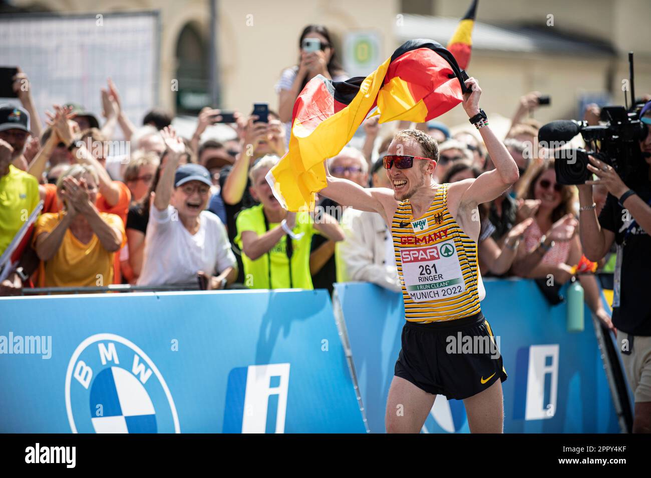 Richard Ringer with his country's flag celebrating his victory in the ...