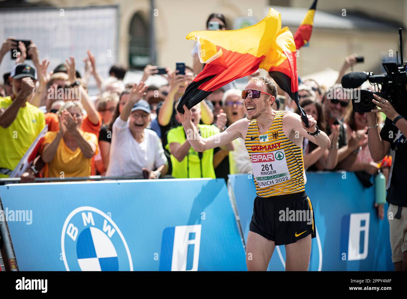 Richard Ringer with his country's flag celebrating his victory in the ...